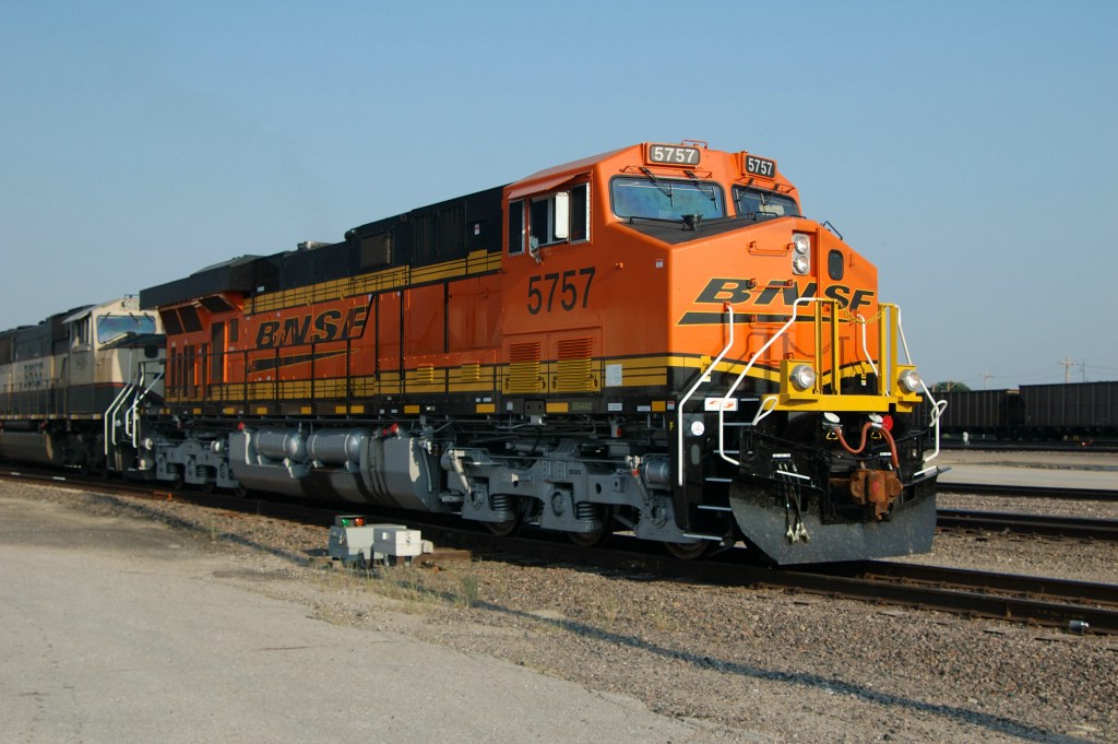 BNSF 5757, GE ES44AC (GEVO), leads a westbound empty hopper train